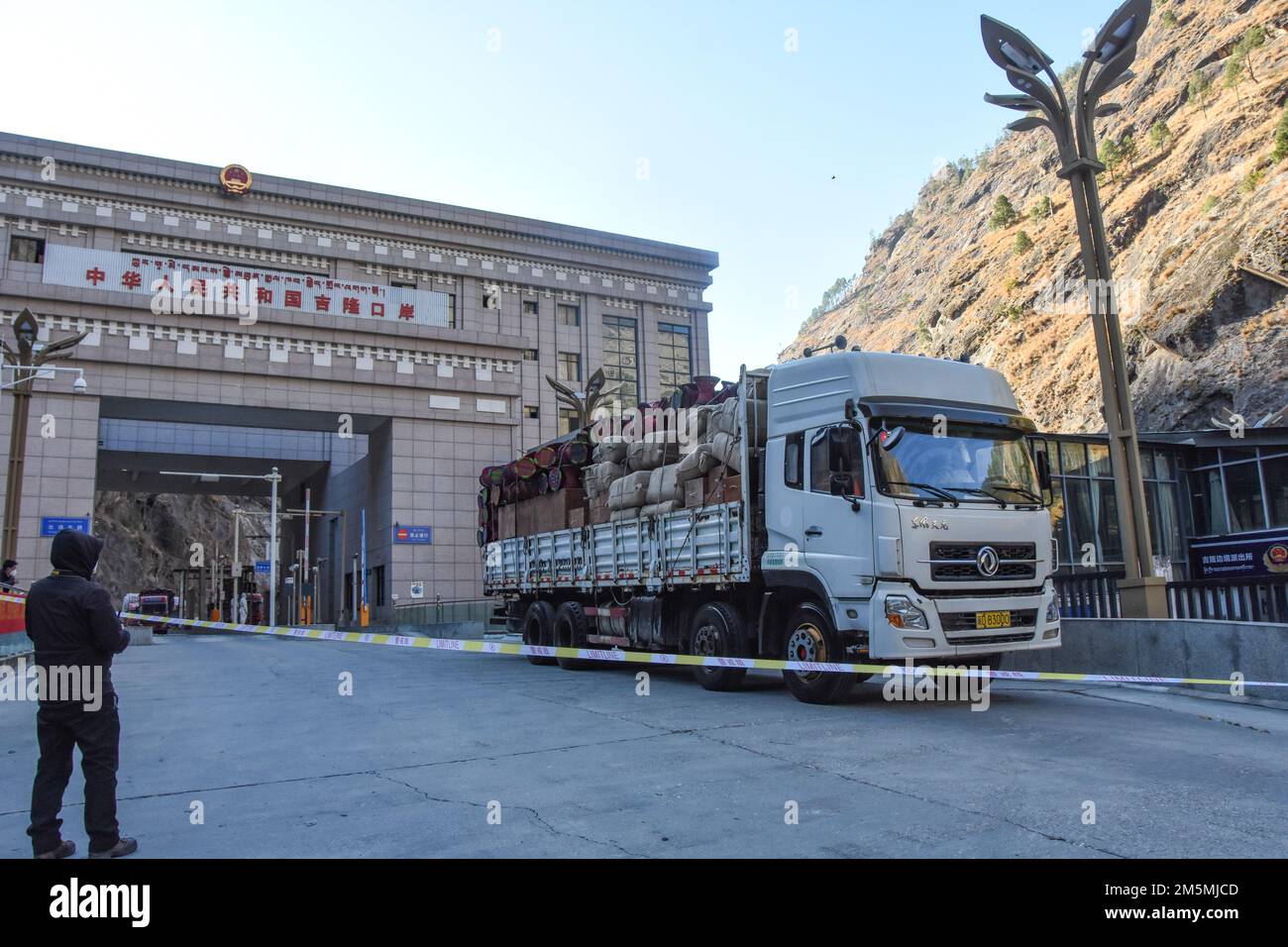 Lhasa. 28th Dec, 2022. A truck loaded with goods from Nepal enters the ...
