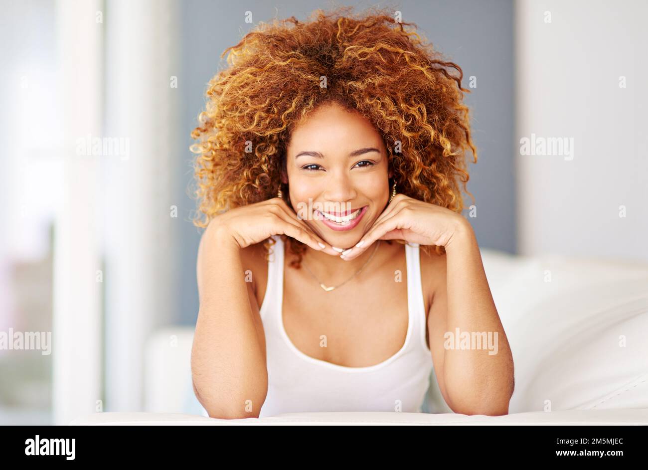 Lets stay home. Portrait of a young woman relaxing at home on the ...
