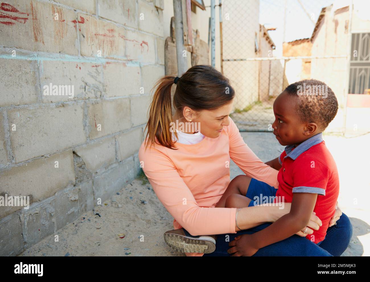 She tries to spend one on one time with every kid. kids at a community ...