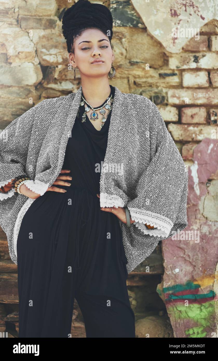 Life isnt perfect but your outfit can be. Portrait of a fashionable young woman posing against a ...