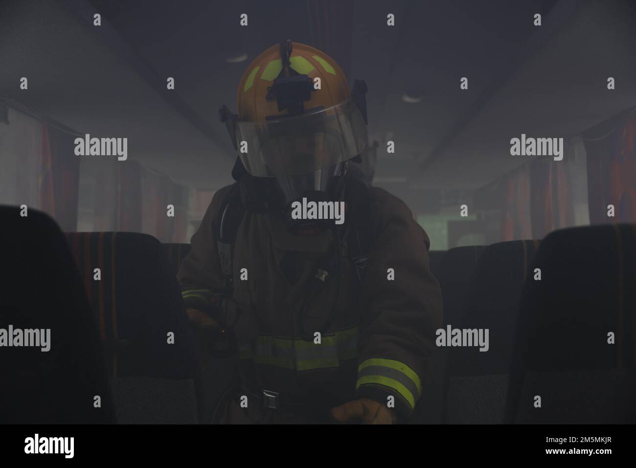 Norwegian firefighters check for people in a bus as part of a live fire ...