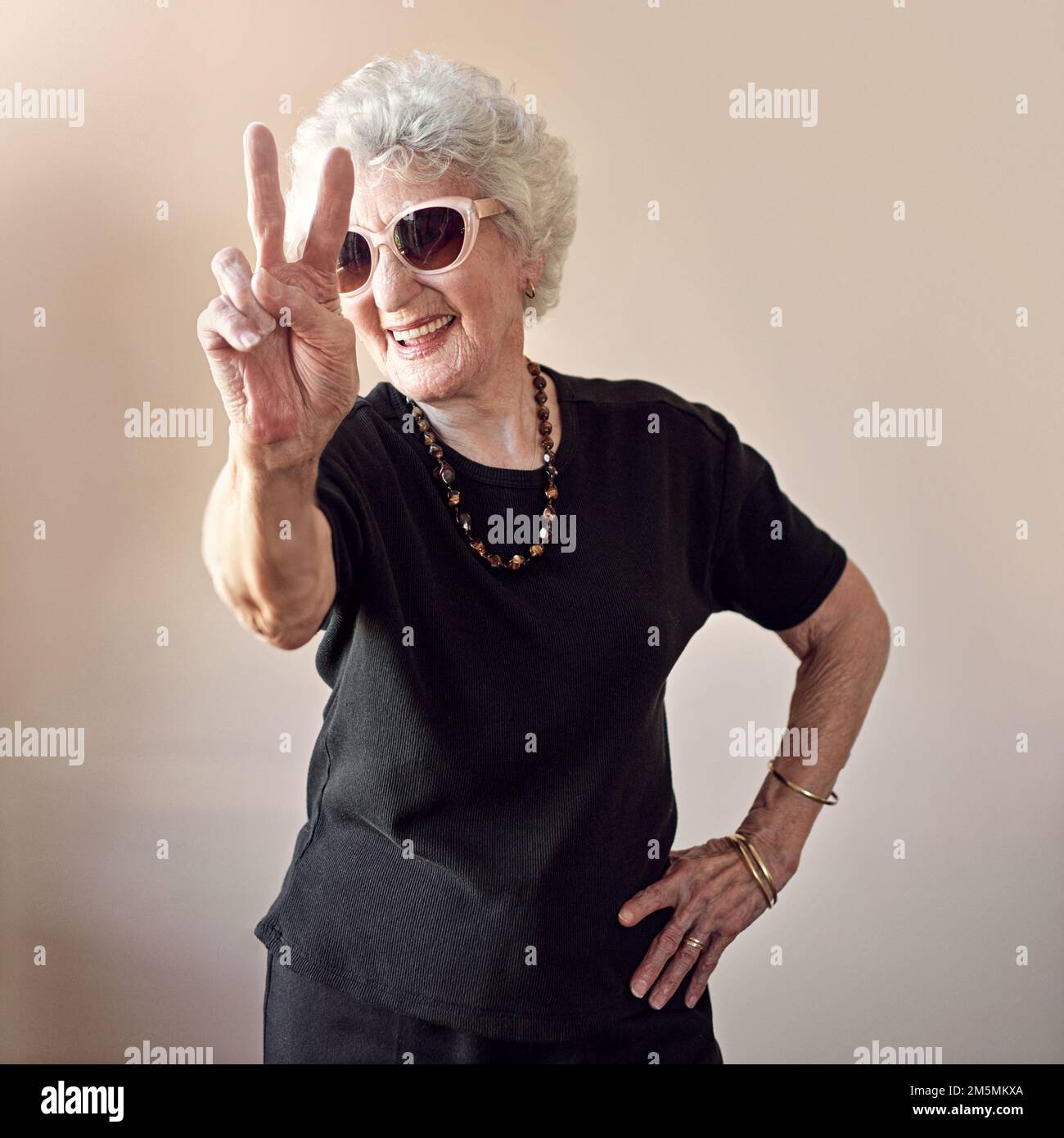 Growing old is mandatory, growing up is optional. a cool senior woman ...