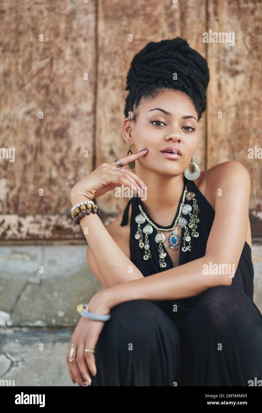 Fashion is always moving forward. Portrait of an attractive young woman posing outdoors Stock ...