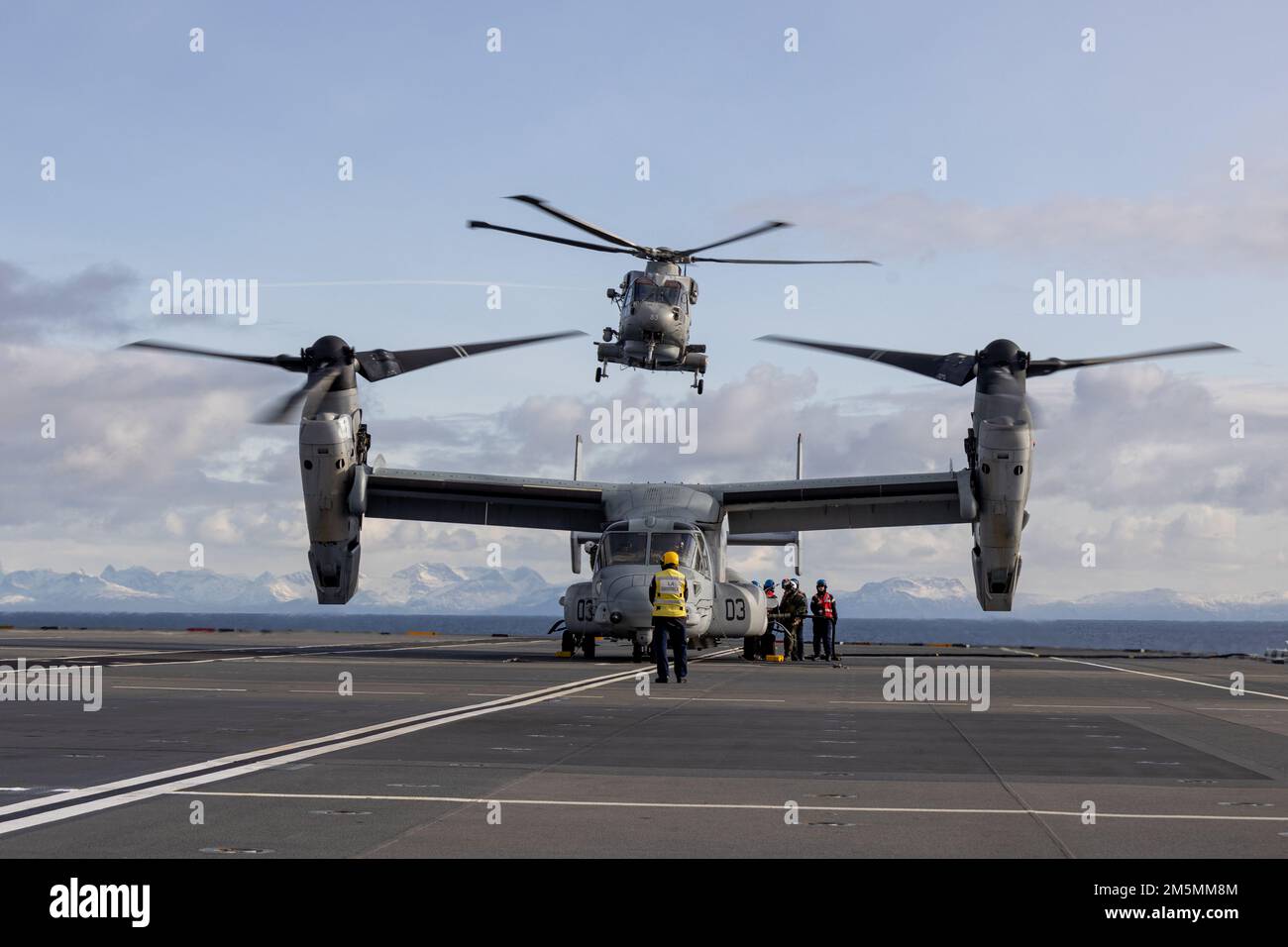 A British Royal Navy Merlin Mk2 helicopter takes off as a U.S. Marine ...