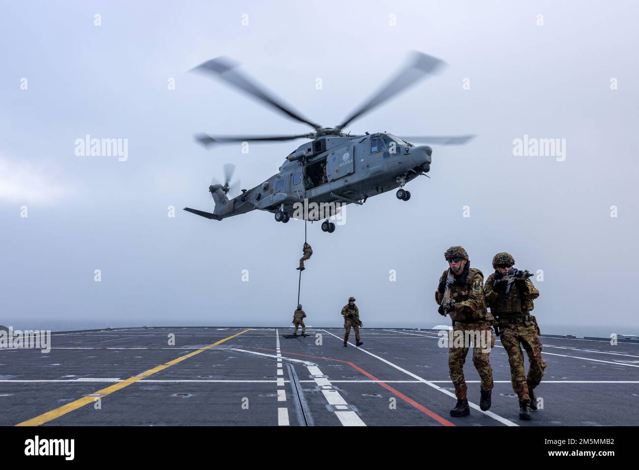 Italian San Marco Brigade marines repel out of an Italian MH101 onto ...