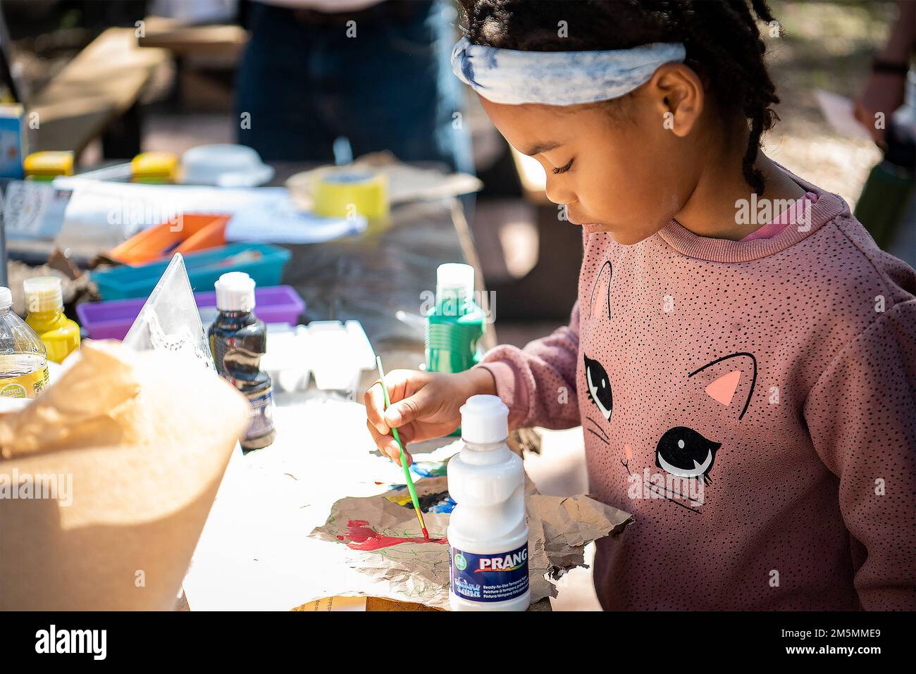 A young girl recreates a historic map at the Eglin Archeology Day at ...