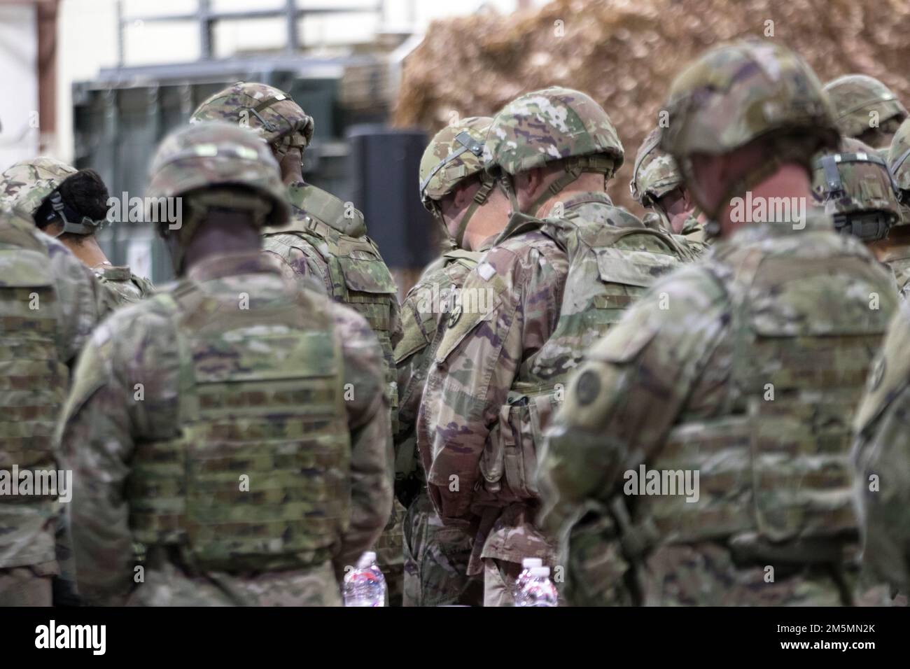 Soldiers assigned to 3rd Expeditionary Sustainment Command bow their ...