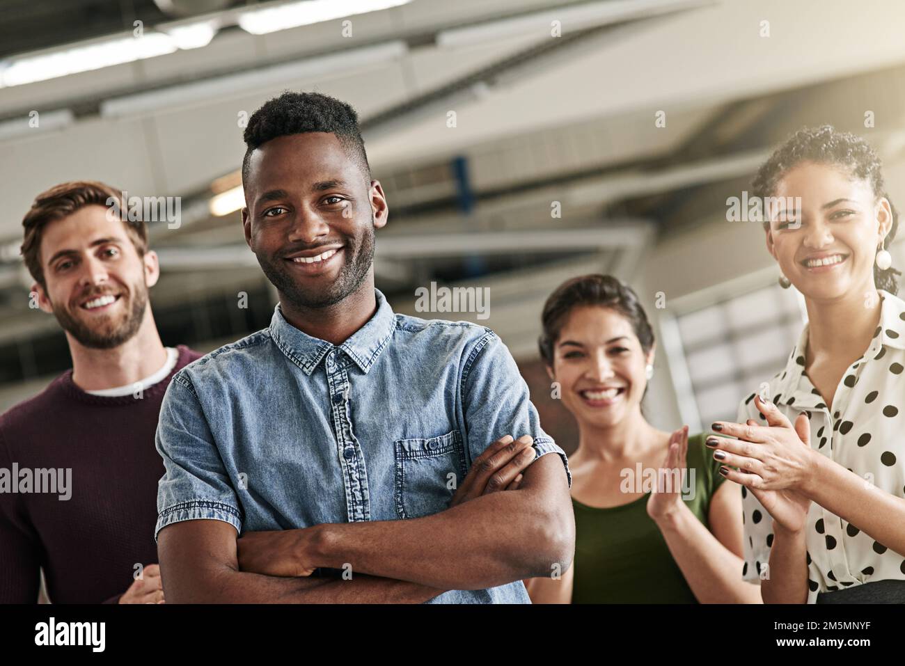 Were team number one. Portrait of a team of colleagues standing in an ...