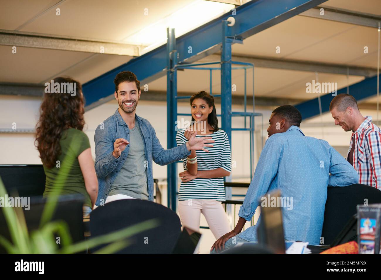 When you work together you win together. a team of colleagues having an ...