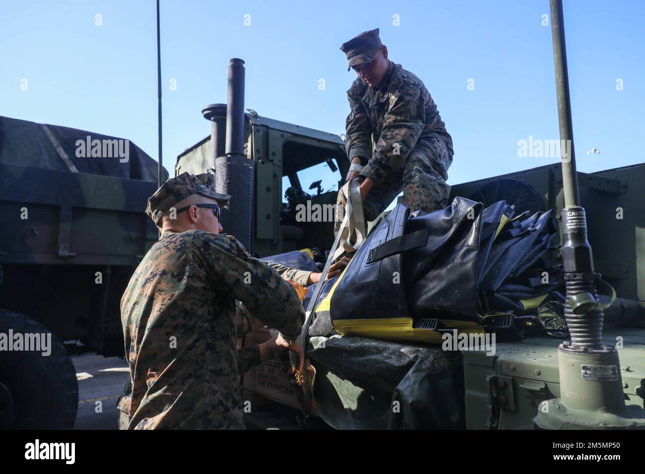 U.S. Marine Corps Lance Cpl. Gabriel Lewis, left, and Lance Cpl. Chase ...