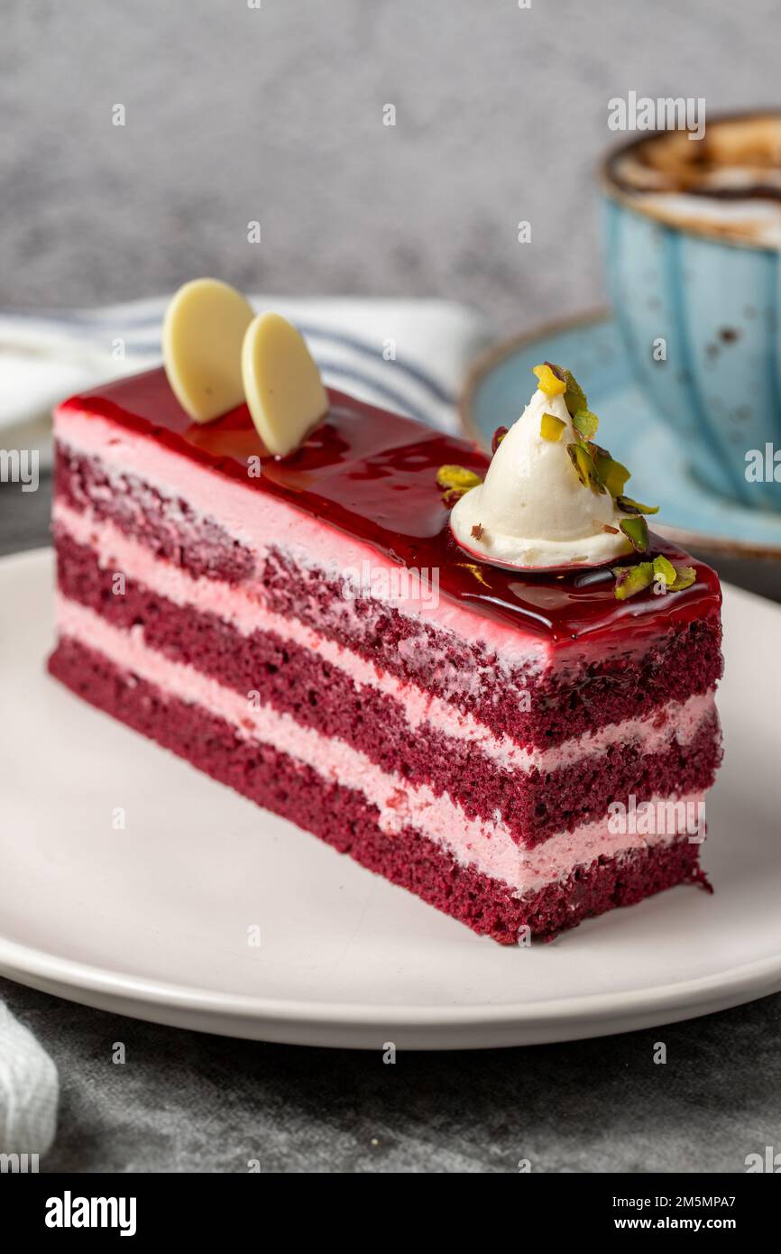 Raspberry cake on a dark background. Layered raspberry cake slice ...