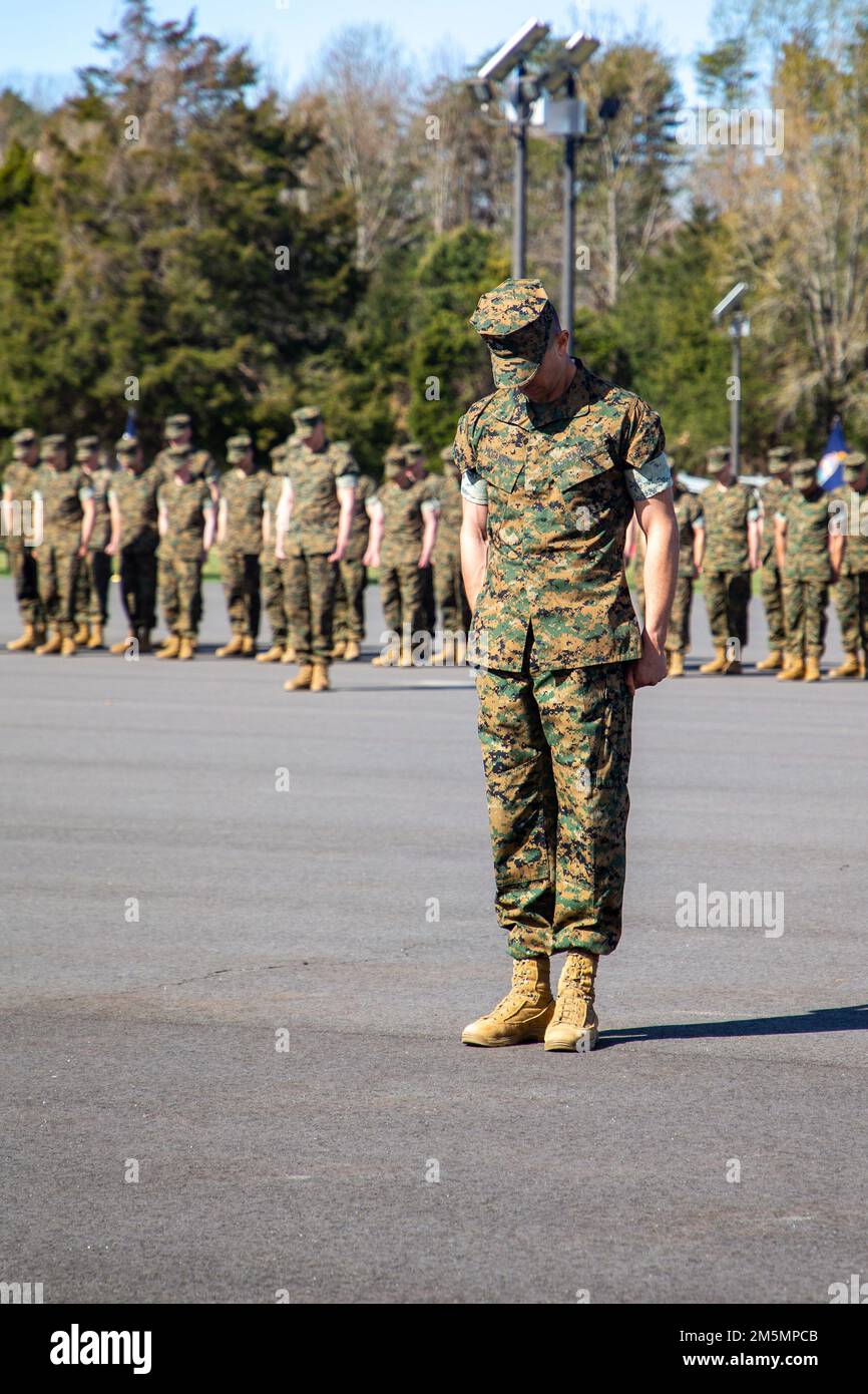 A U.S. Marine officer candidate bows his head for the benediction at ...