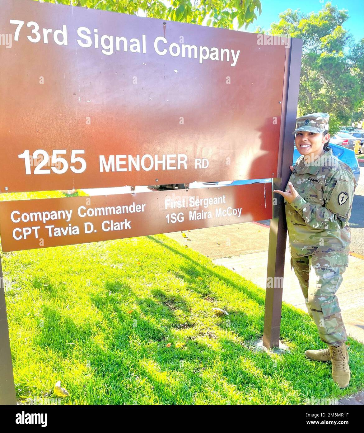 1st Sgt. McCoy poses next to her name on the 73rd Signal Company ...