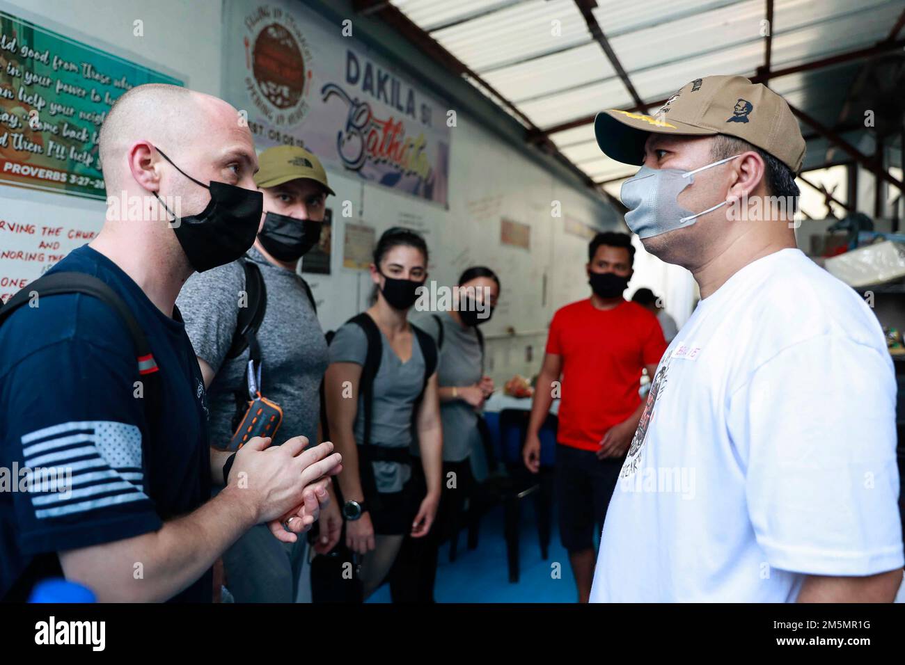 MANILA, Philippines (March 27, 2022) Chief Yeoman Ryan Mahan, left ...