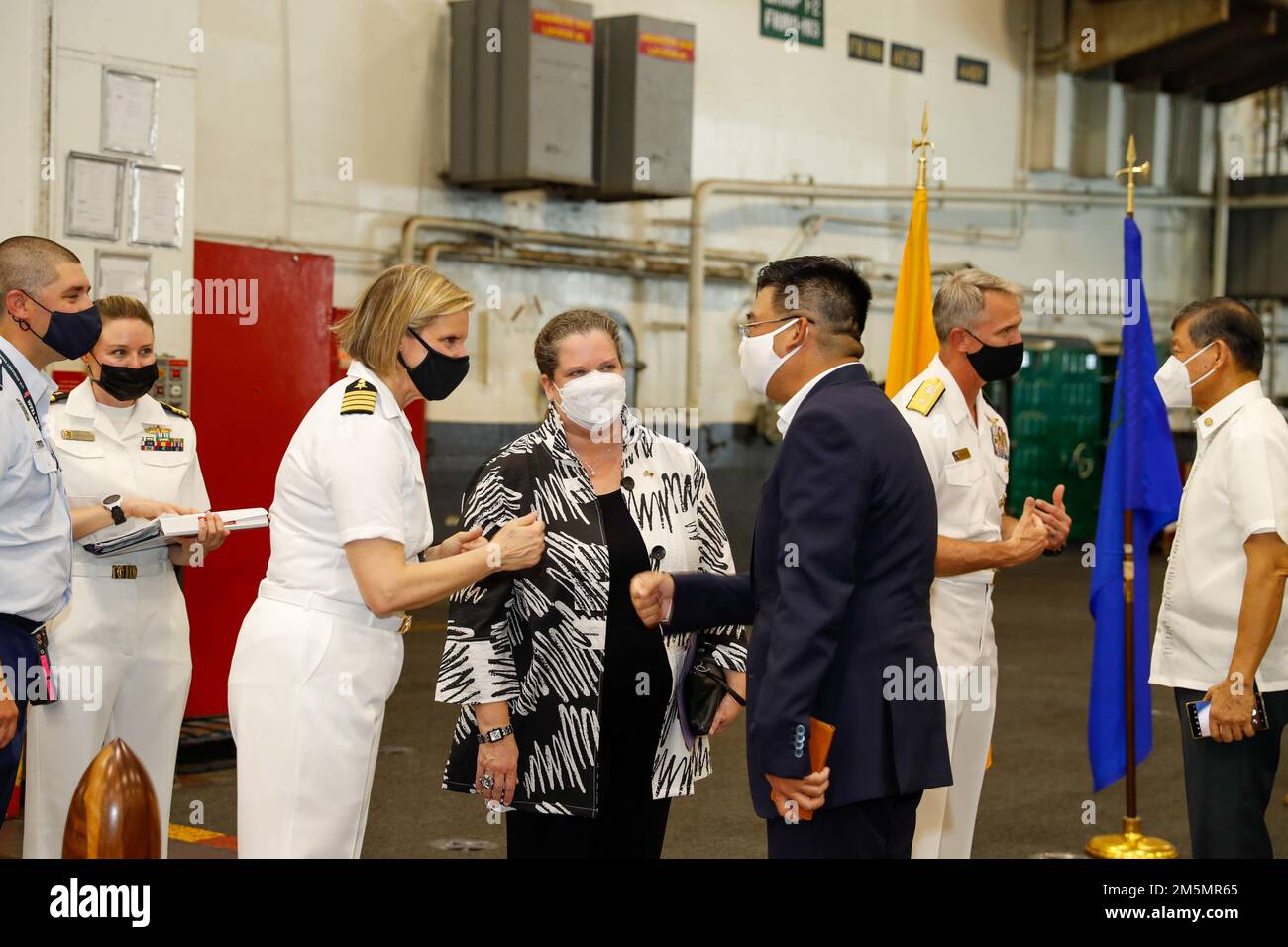 MANILA BAY, Philippines (March 27, 2022) Capt. Amy Bauernschmidt, left ...