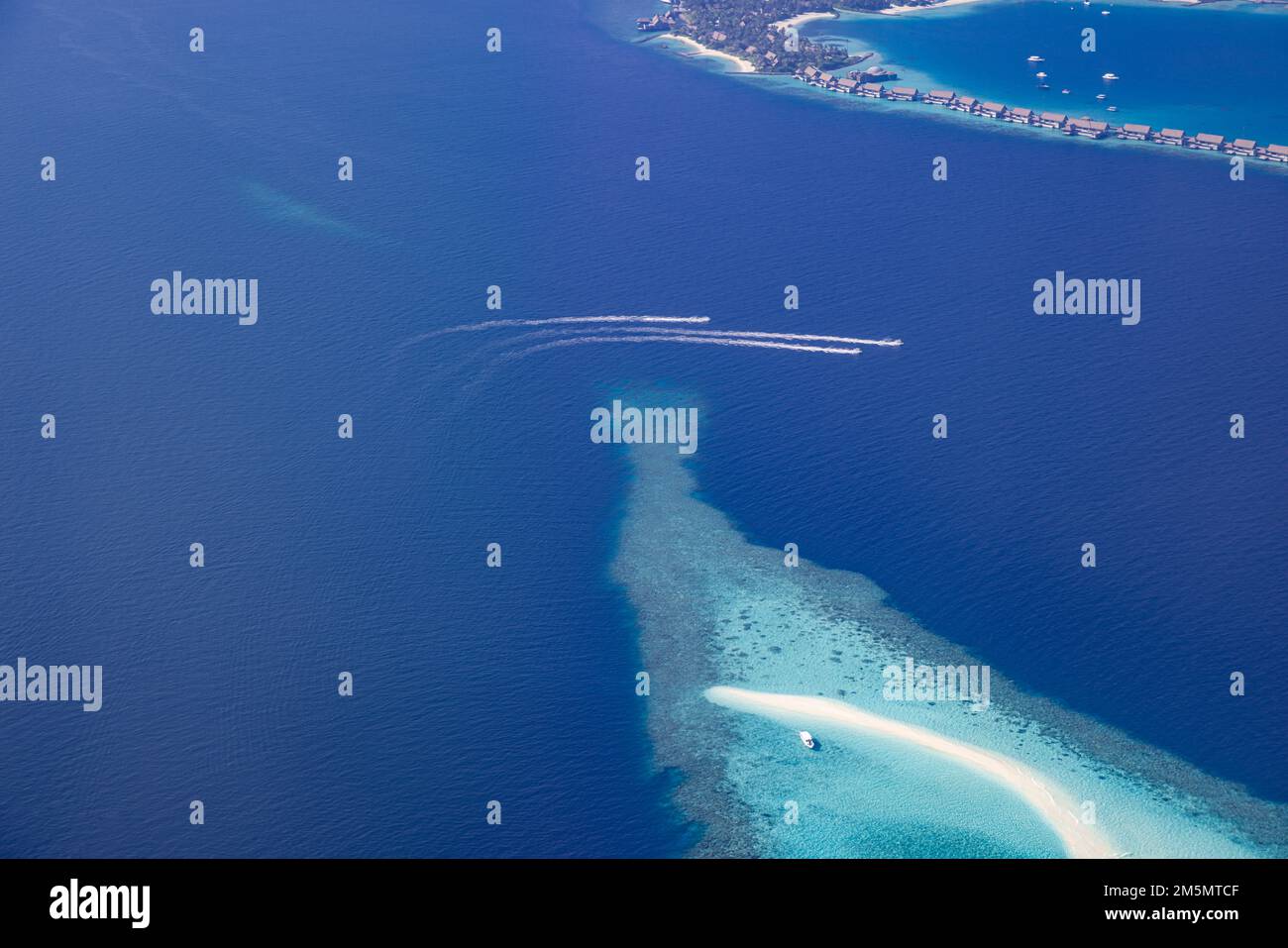 Landscape seascape aerial view over Maldives luxury resort villas with ...