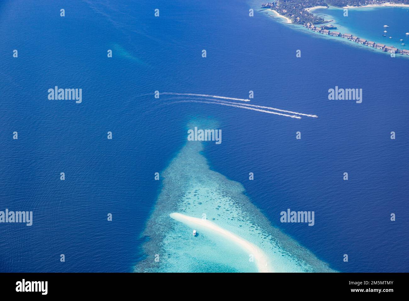 Landscape seascape aerial view over Maldives luxury resort villas with ...