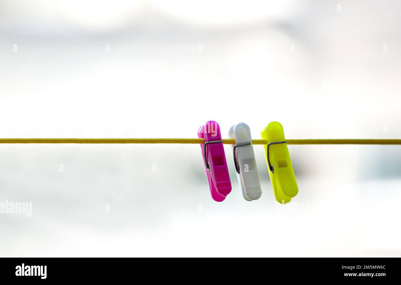 Colorful clothespins against the blurred background. Plastic ...