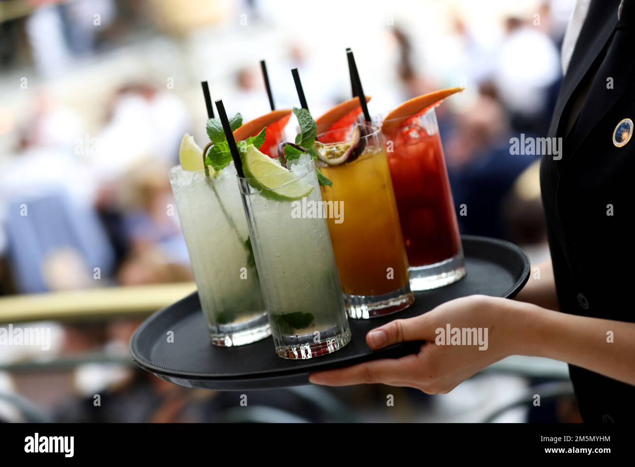 Cocktails and nice looking drinks pictured being served by a waitress ...