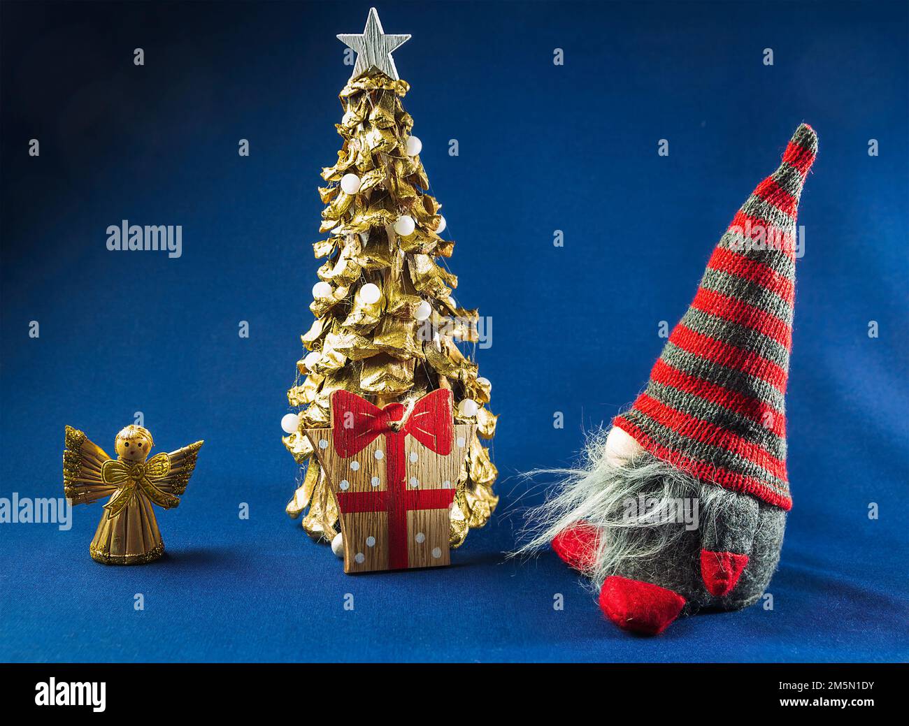 Christmas decoration elf, dwarf with angel standing around christmas ...