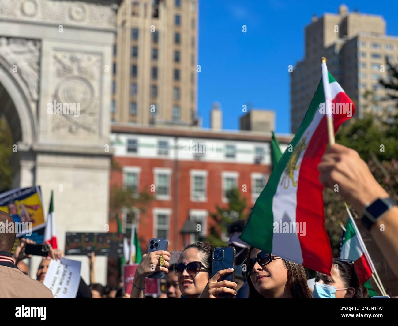 A closeup of people gathering in the park in support of basic human ...