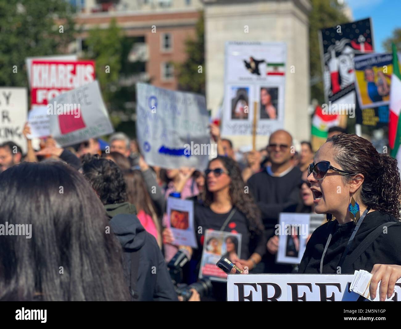 A closeup of people gathering in the park in support of basic human ...