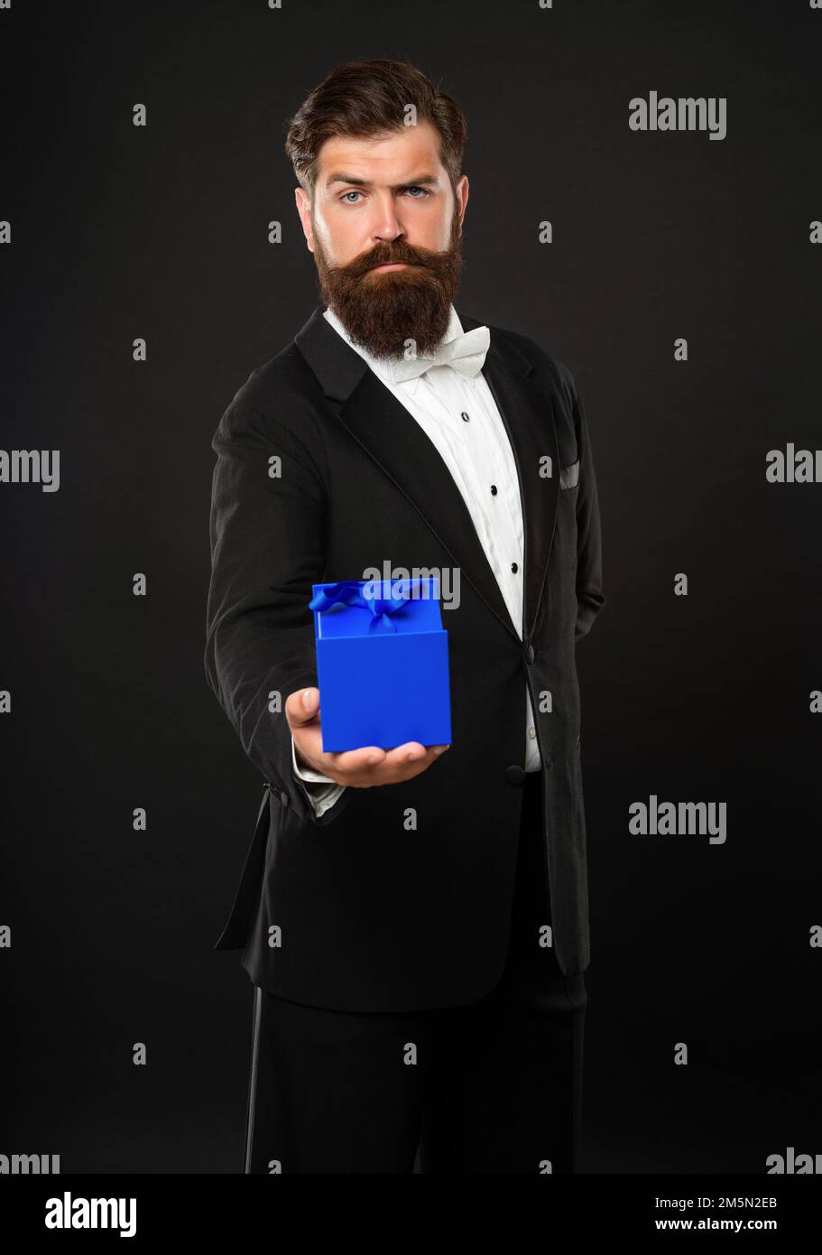 man in tuxedo bow tie formalwear on black background with business ...