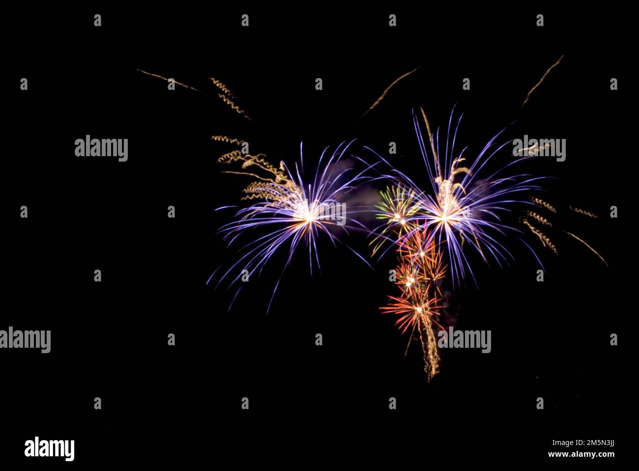 The colorful fireworks shining bright in the dark black night sky Stock ...