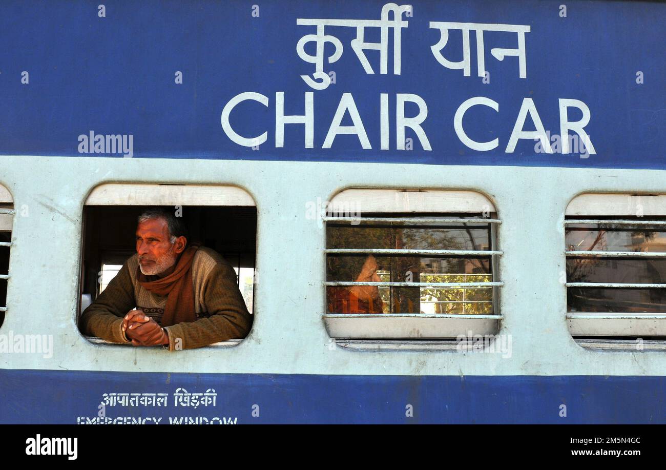 India. Rajasthan. A train passenger in a seat car (3rd class Stock ...
