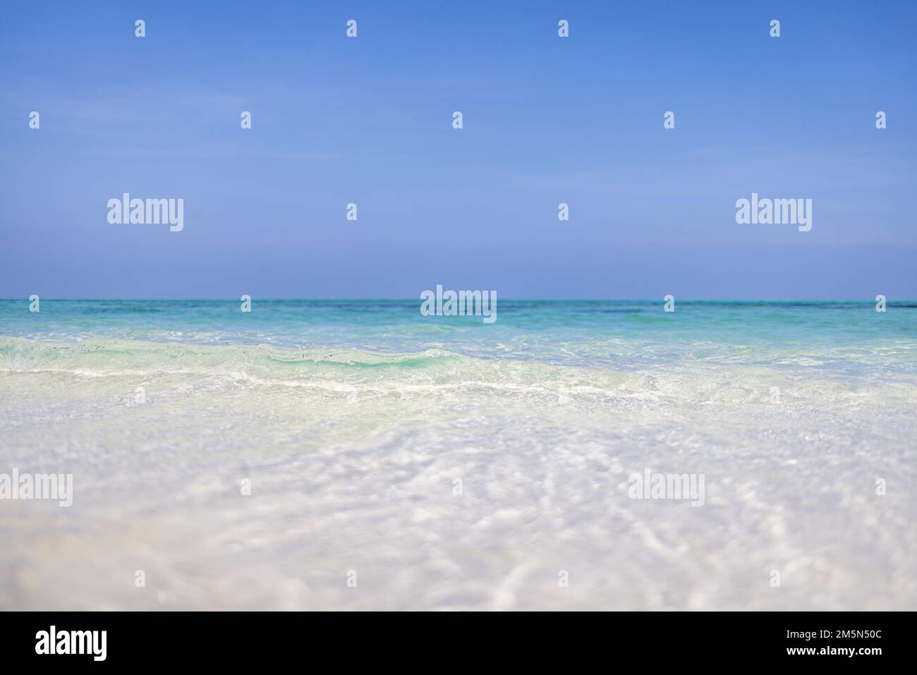 Crystal clear sea water bay. Pristine ocean lagoon sunny cloudy sky ...