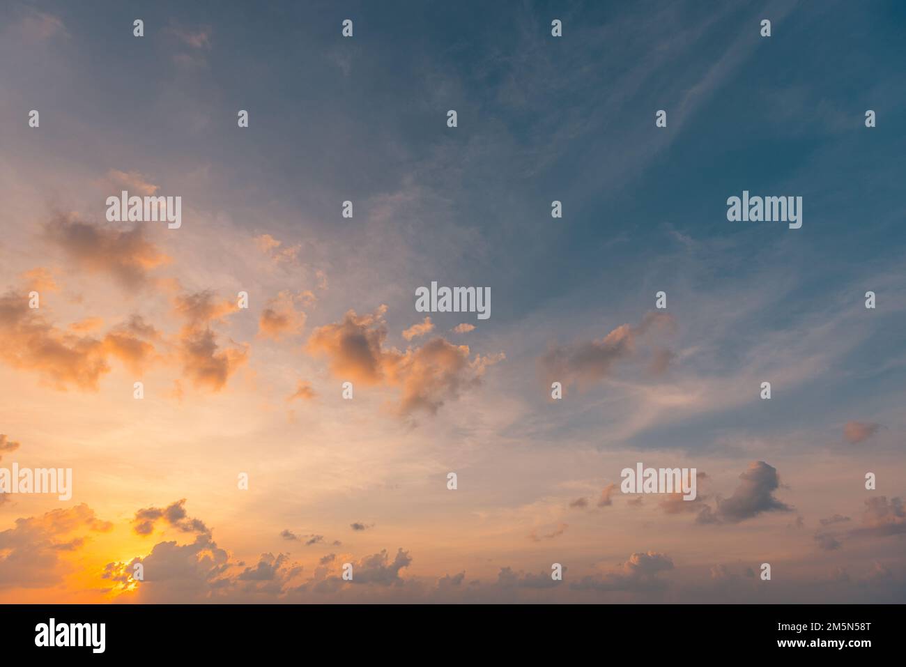 Panorama of orange sunset sky cloudy view with bright sun. Relaxing ...
