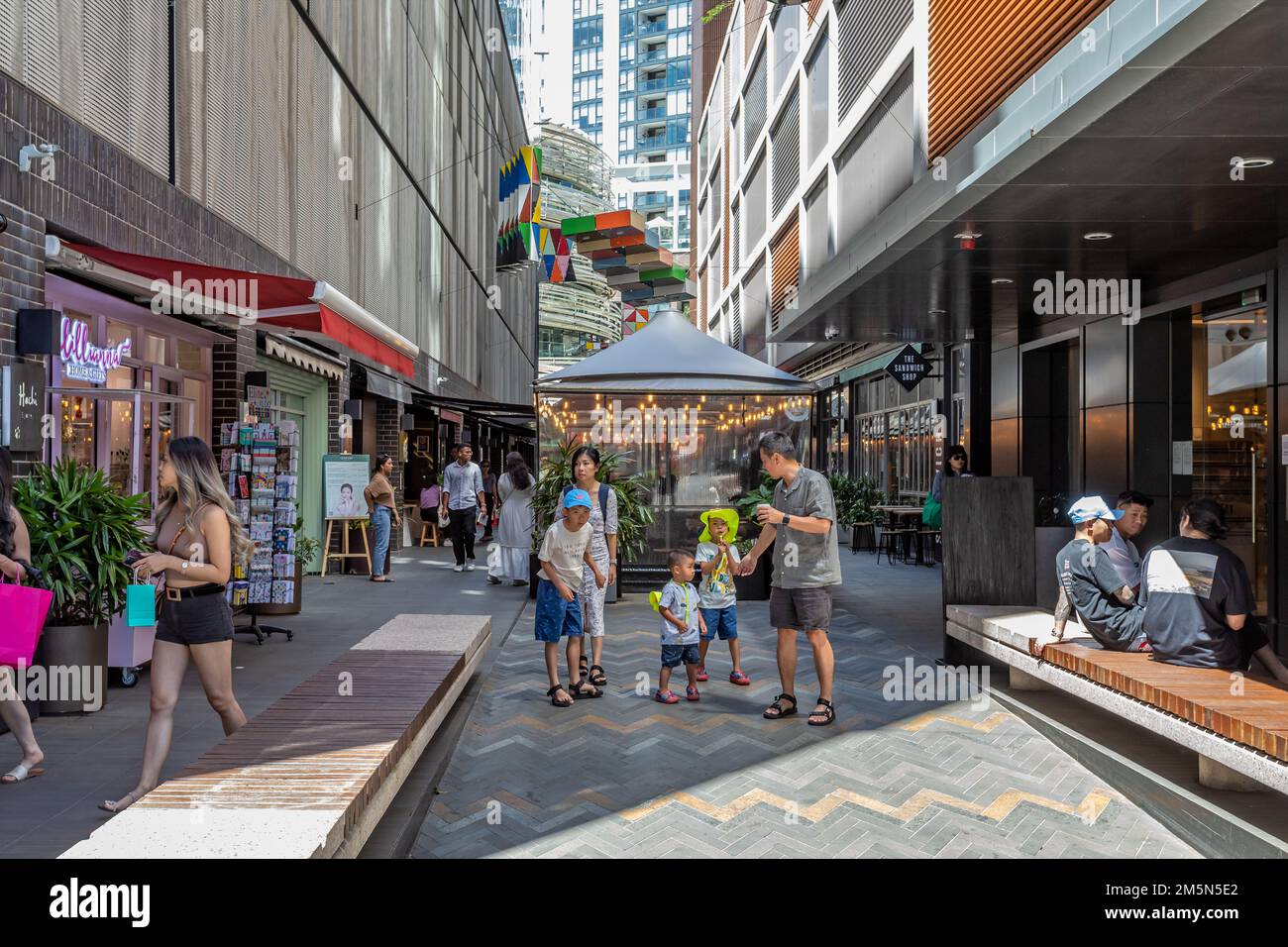 Shops and cafes in pedestrian walkway near The Exchange building near ...