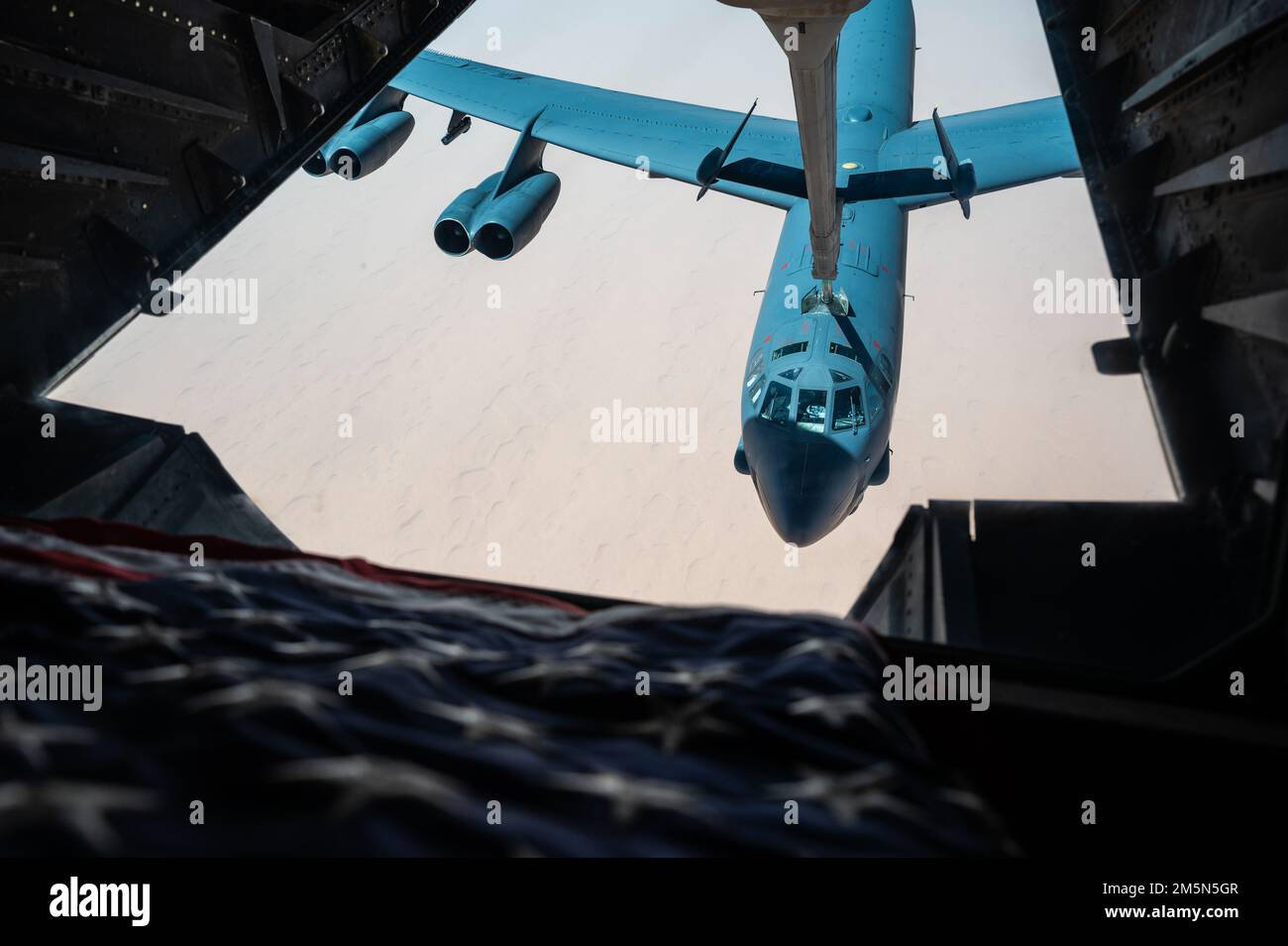 A U.S. Air Force B-52H Stratofortress receives fuel from a U.S. Air ...