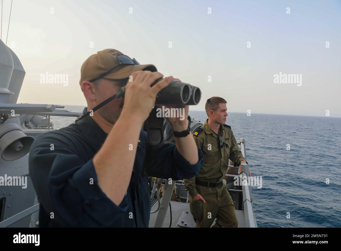 220329-N-CS075-1001 RED SEA (March 29, 2022) Ensign Ethan Guerra and an ...