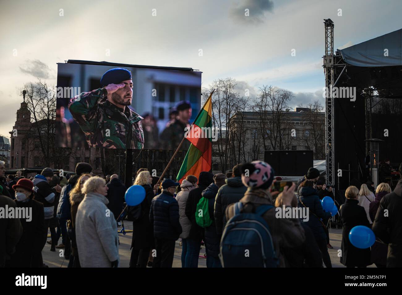 A big screen projection of a soldier saluting during the celebration of ...
