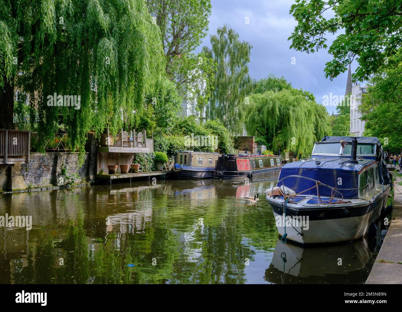 Boats docked on both sides of Regent’s Canal between Gloucester Ave ...