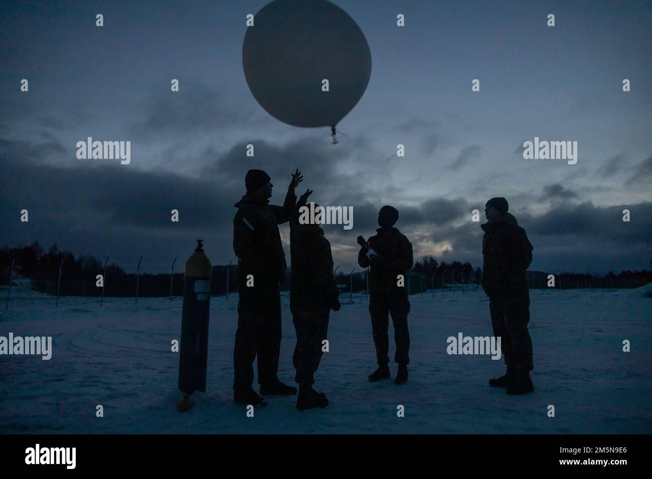 U.S. Marines launch a weather balloon during Exercise Cold Response ...