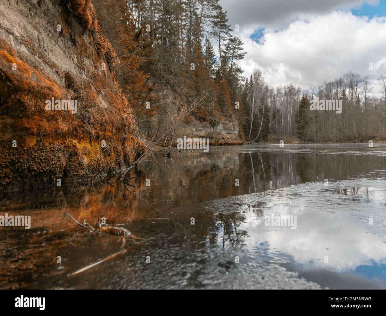 landscape with sandstone cliff on the river bank, Ramatu cliffs, Gauja ...