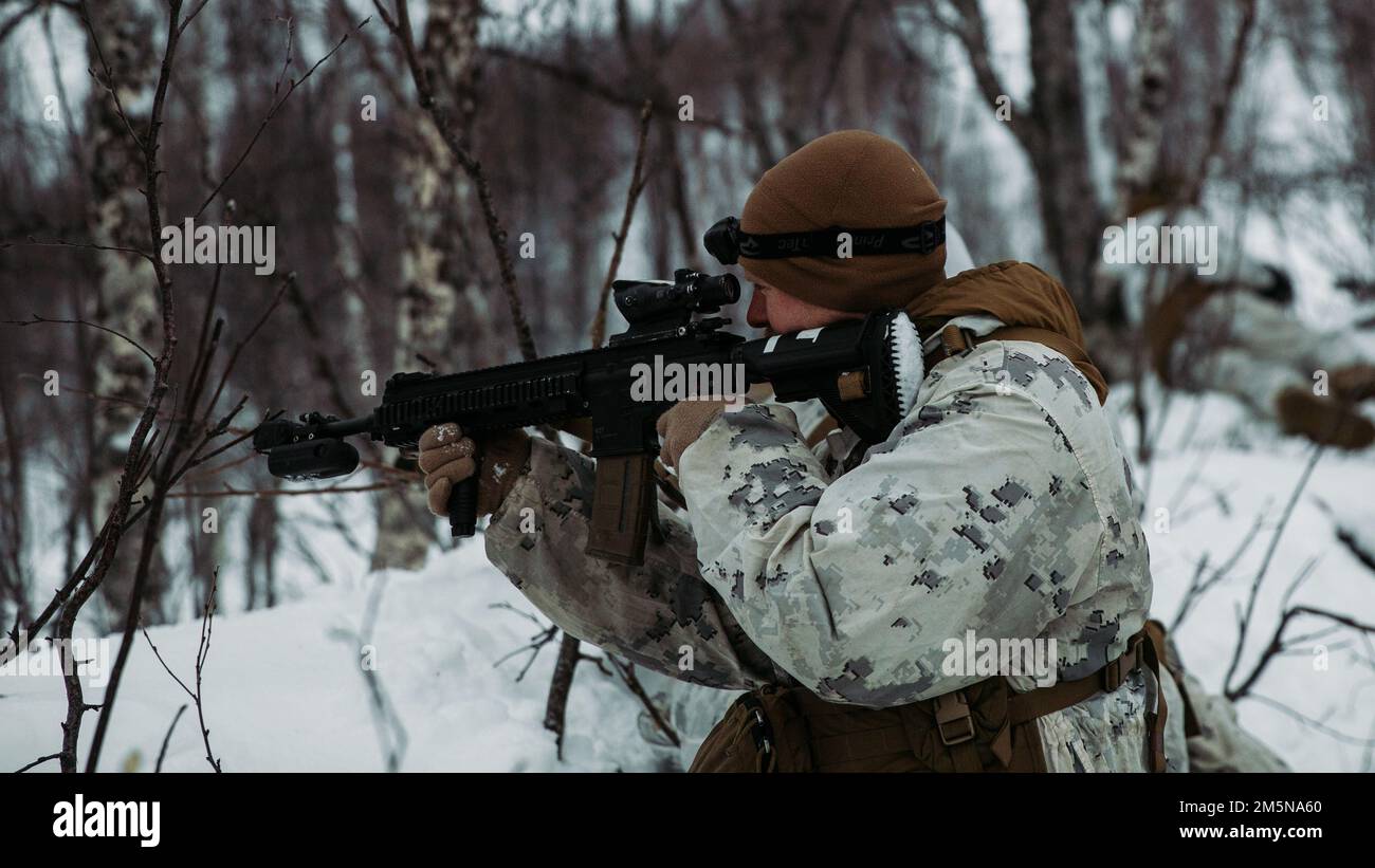 U.S. Marine Corps Cpl. Jacob Johnson engages with an opposing force ...
