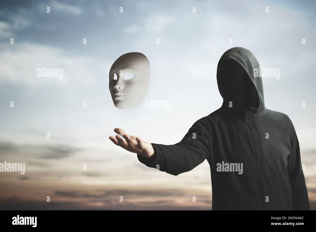 surreal image of a man with obscured face throwing a mask in the air ...