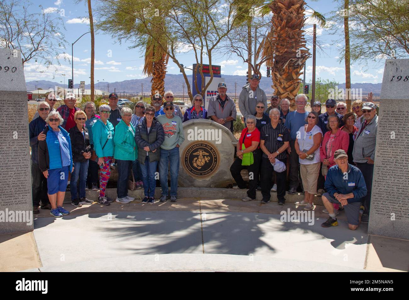 Tour participants pose for a group photo at Marine Corps Air Ground ...