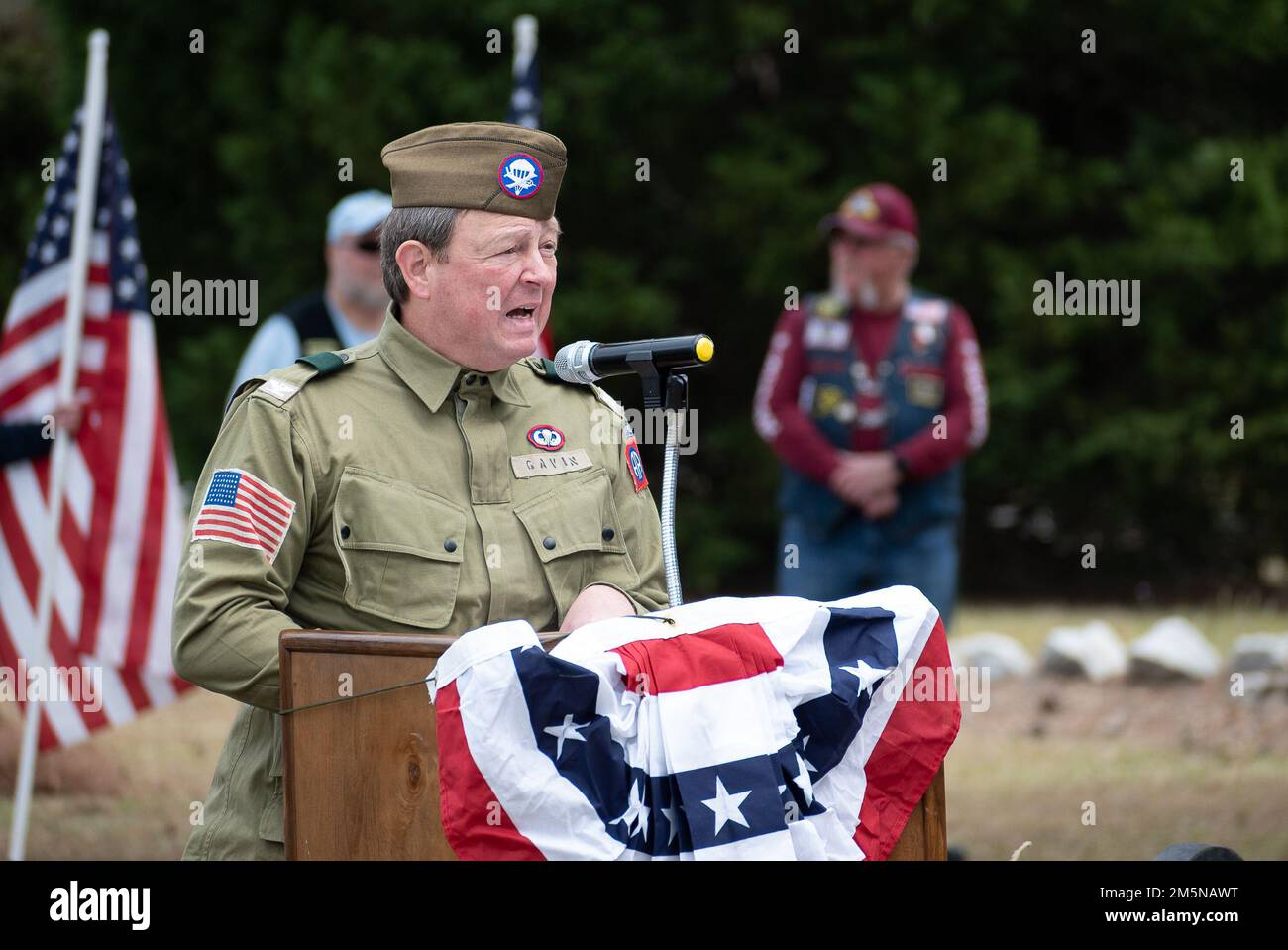 U.S. Army Mr. Robert Anzuoni, historian, addresses the crowd at a ...