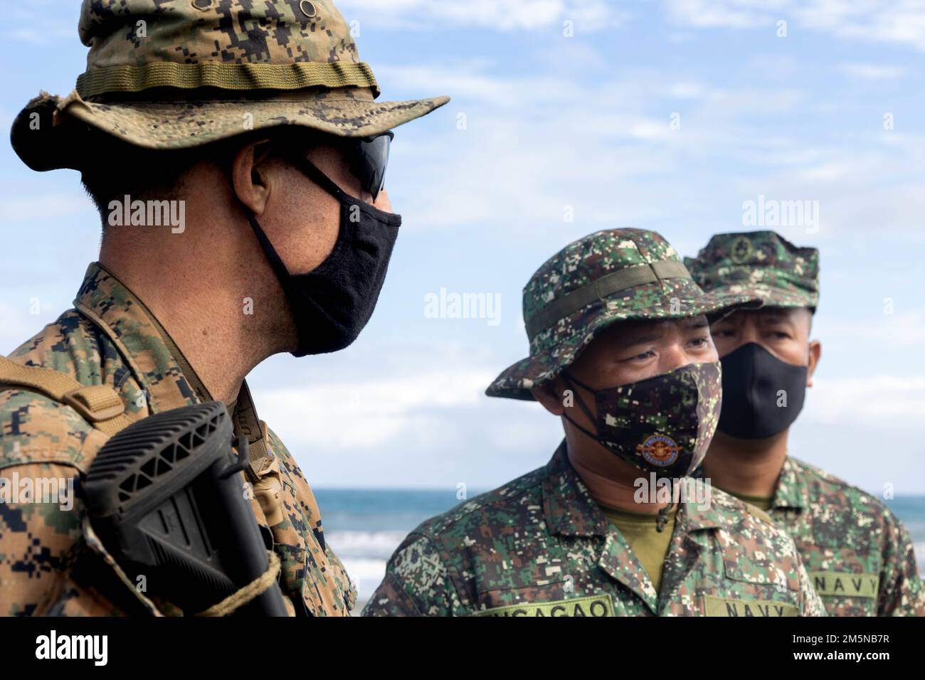Philippine Marine Corps Maj. Tugagao, with Marine Battalion Landing Team 10, discusses coastal ...