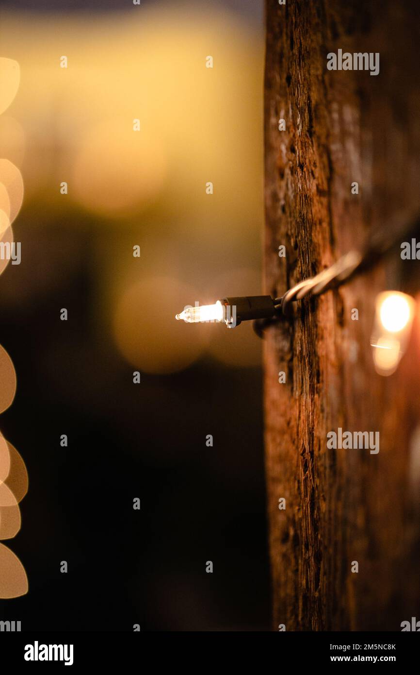 A vertical shot of a decorative street light on a support beam in ...