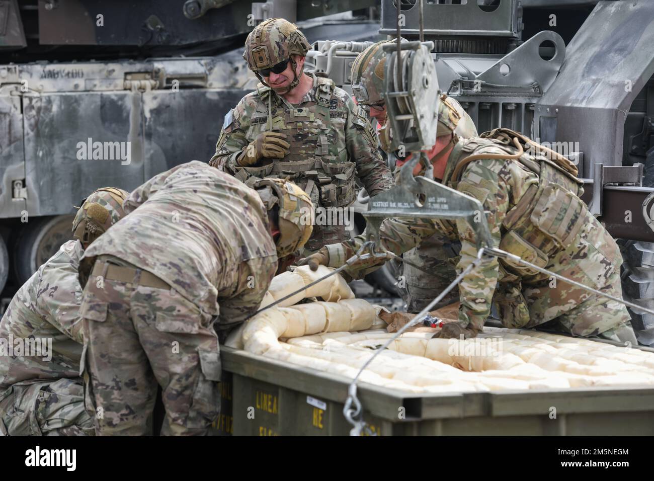 U.S. Army Lt. Col. Alexander Samms, center, commander of 10th Brigade ...