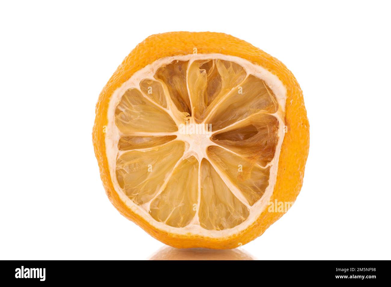 One cut dried lemon, macro, isolated on white background Stock Photo ...