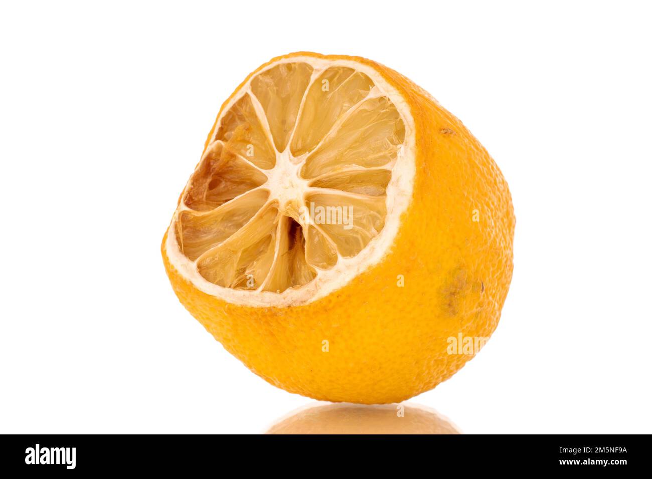 One cut dried lemon, macro, isolated on white background Stock Photo ...