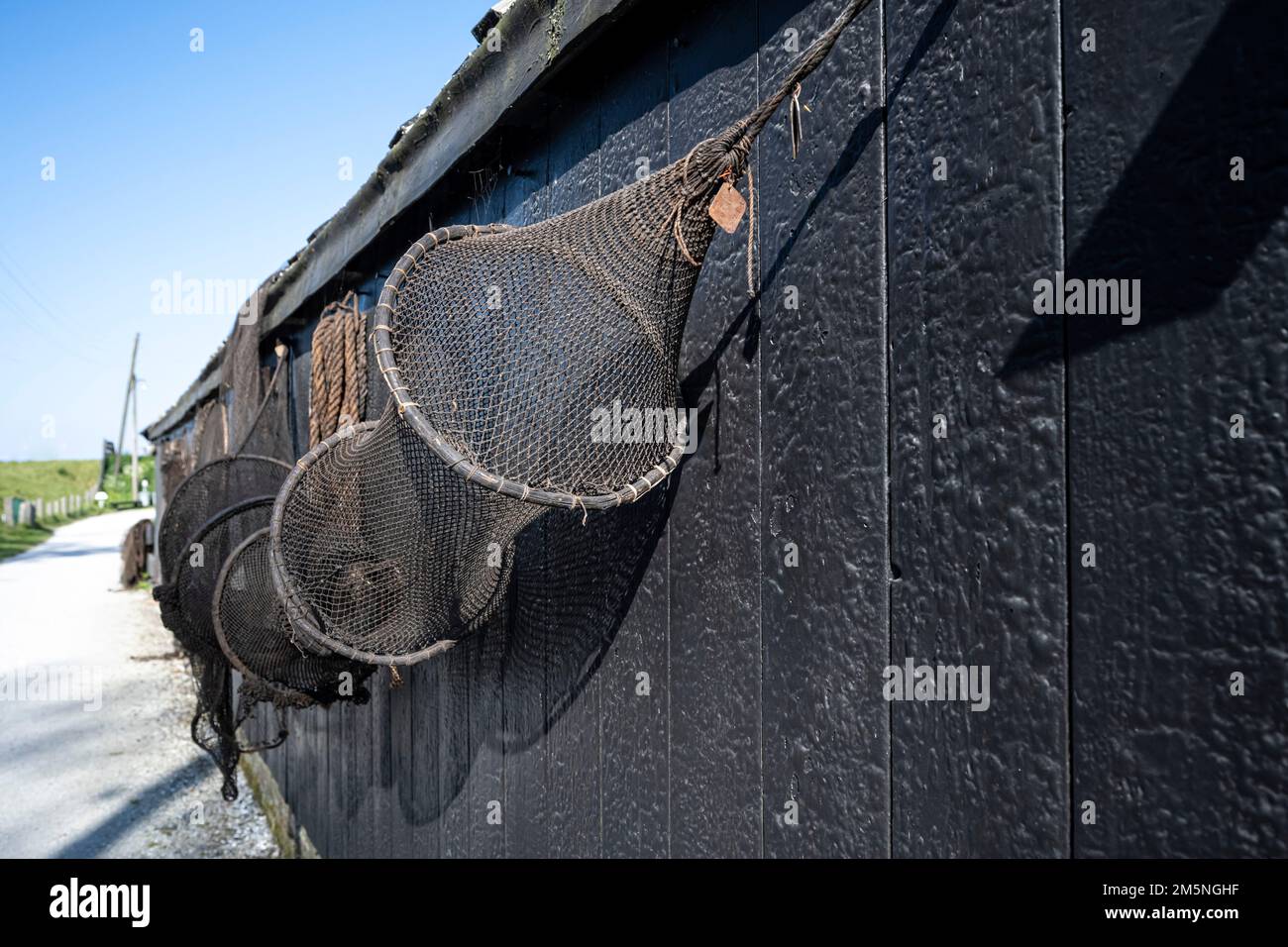 Fishing net hanging house hi-res stock photography and images - Alamy
