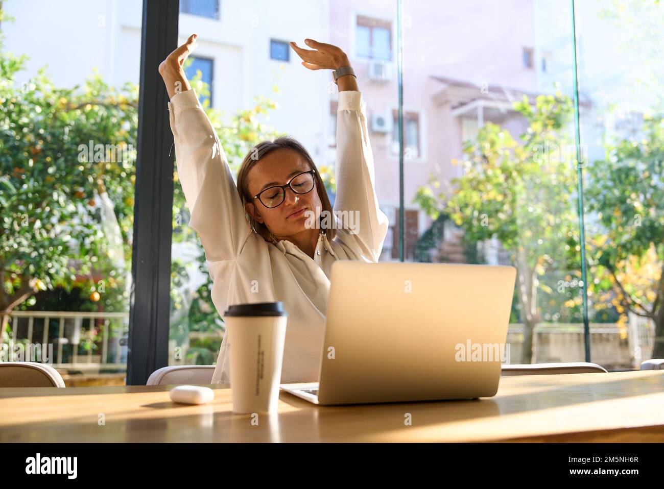 Happy female designer finishing work Stock Photo - Alamy