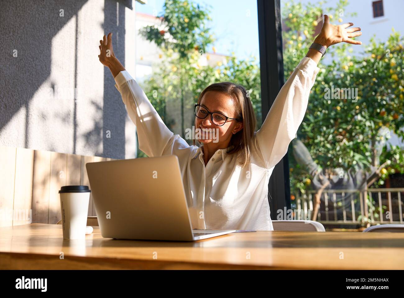Happy female designer finishing work Stock Photo - Alamy